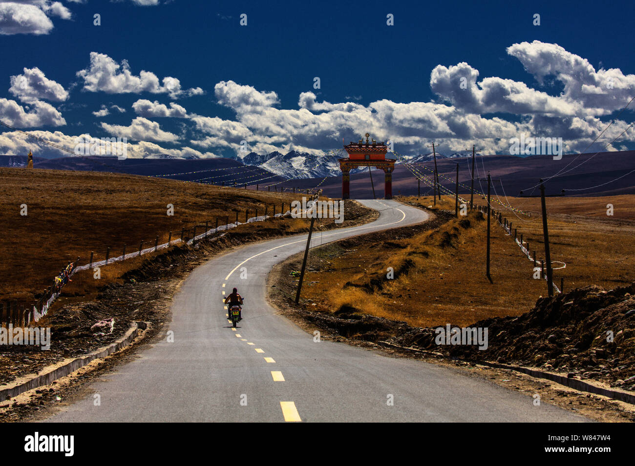 View of a road leading to the Yarchen Gar Monastery, known as the Yaqen ...