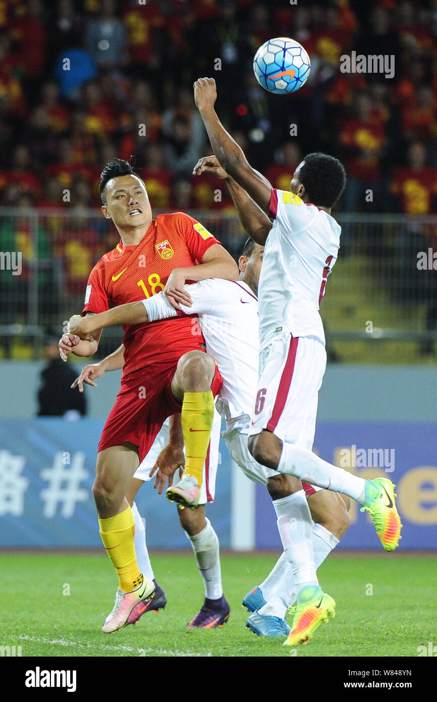 Gao Lin of China, left, challenges players of Qatar in their Group A ...