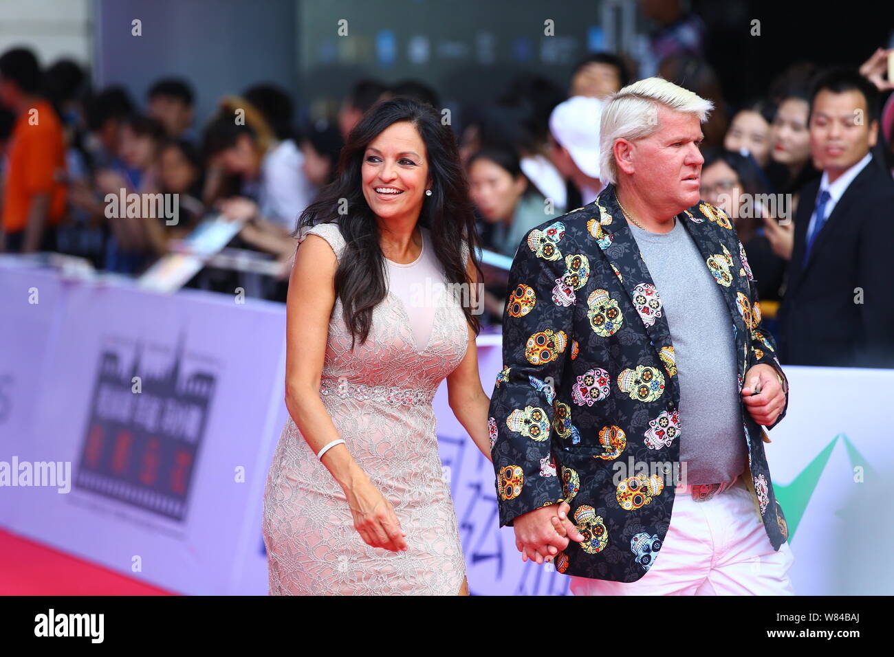 American golfer John Daly, right, and his wife arrive on the red carpet ...