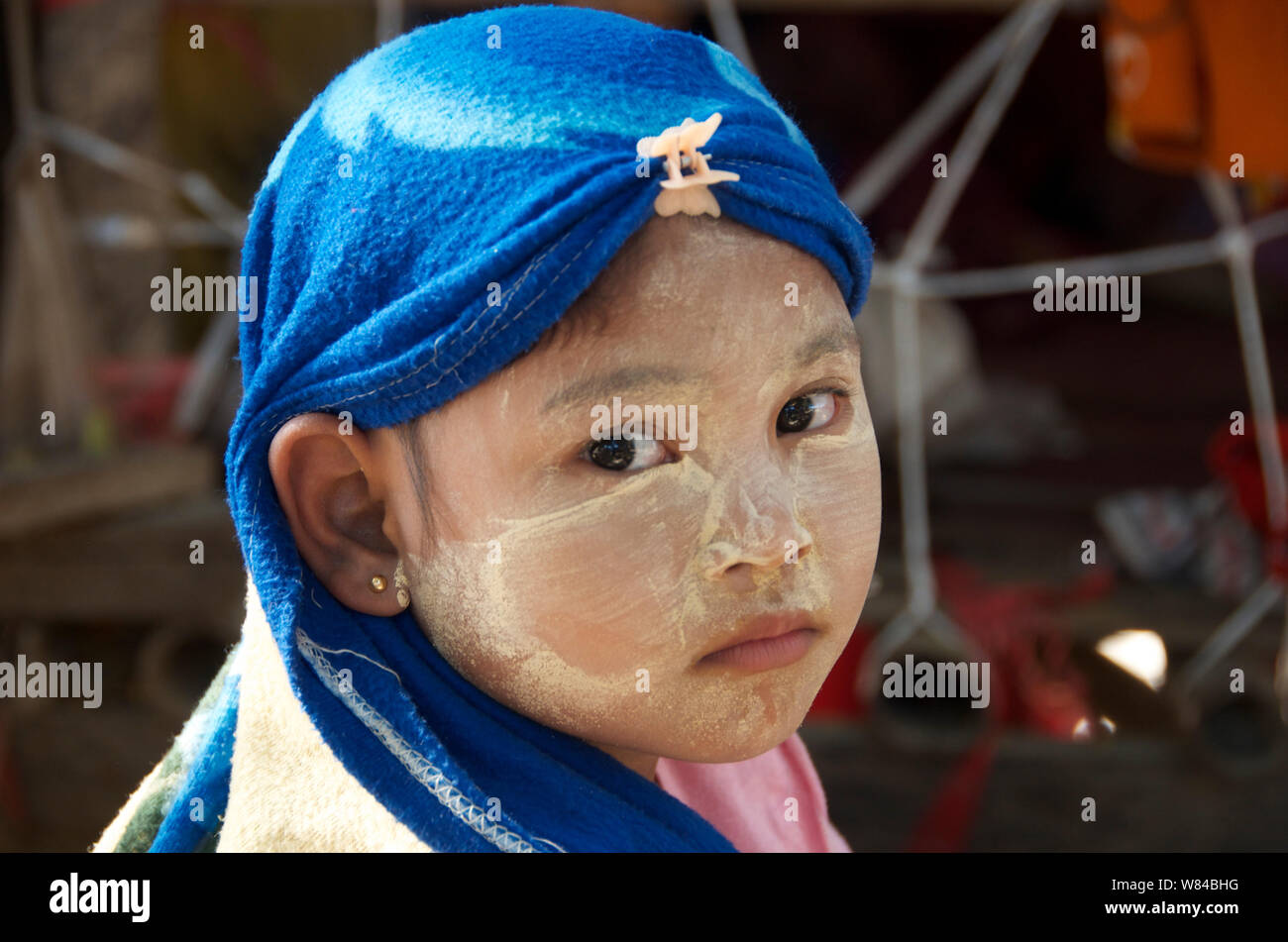 portrait of a young Burmese girl with makeup face of Thanaka on the shore of the Irrawaddy Stock ...