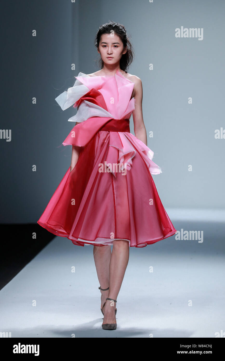 Models display new creations at the fashion show of Raffles Design ...