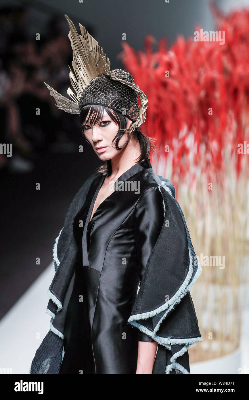 A model displays a new creation at the fashion show of Ji Cheng during ...