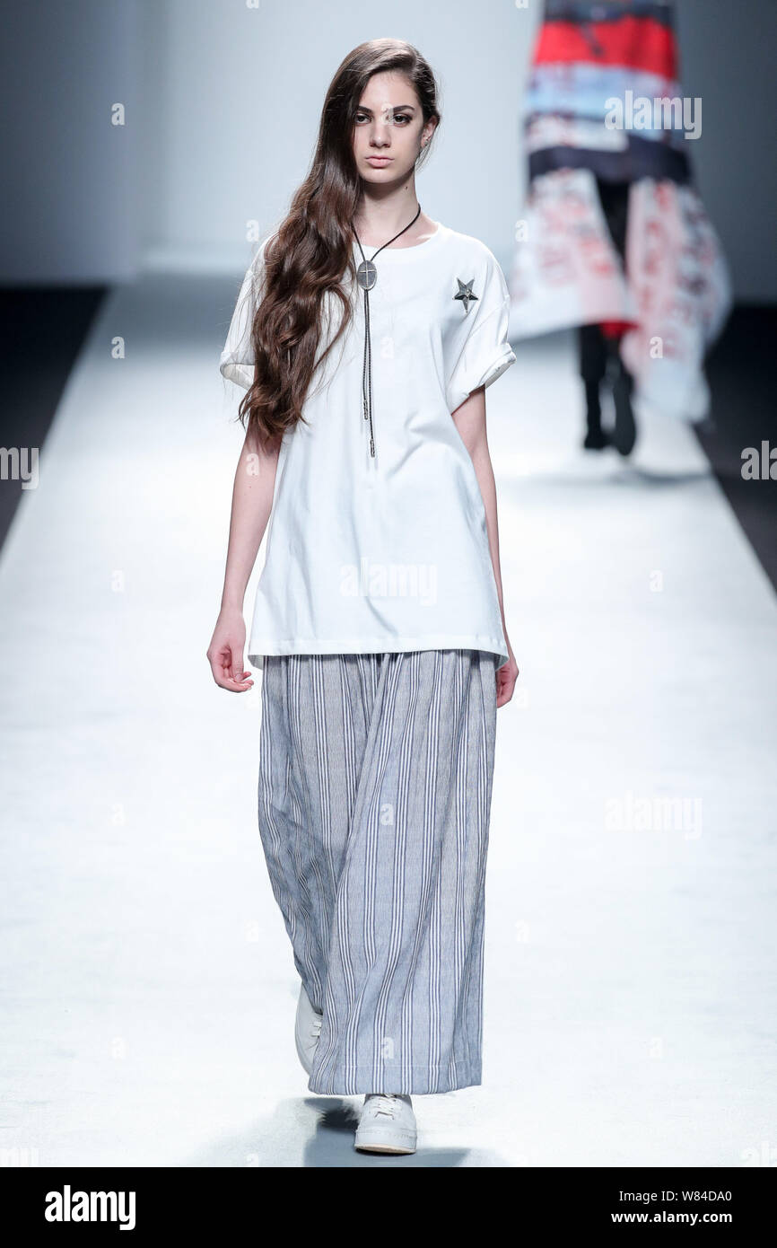 A model displays a new creation at the fashion show of Yaki Hidomi ...