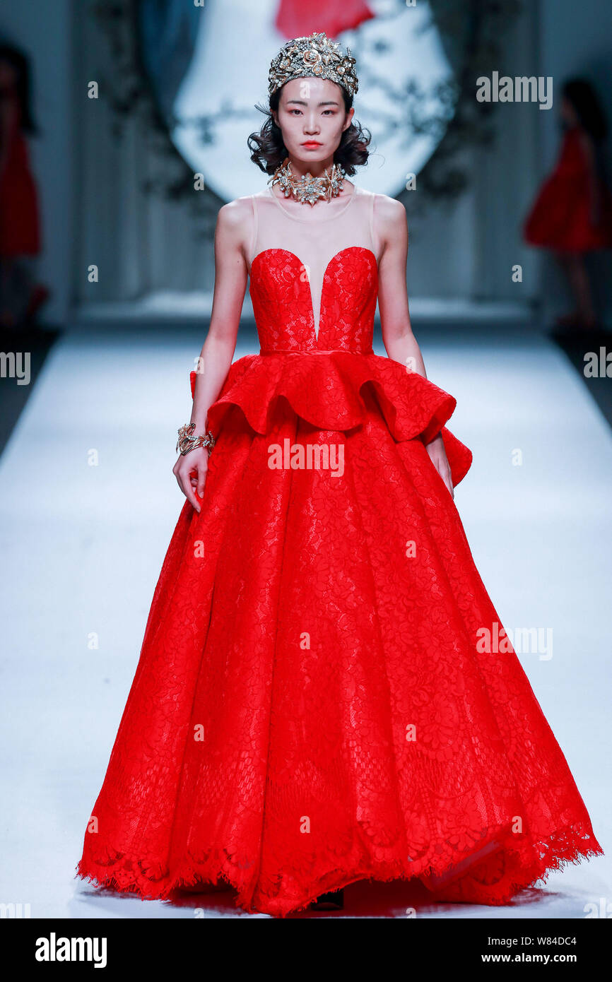 A model displays a new creation at the fashion show of J.Queen & Little ...