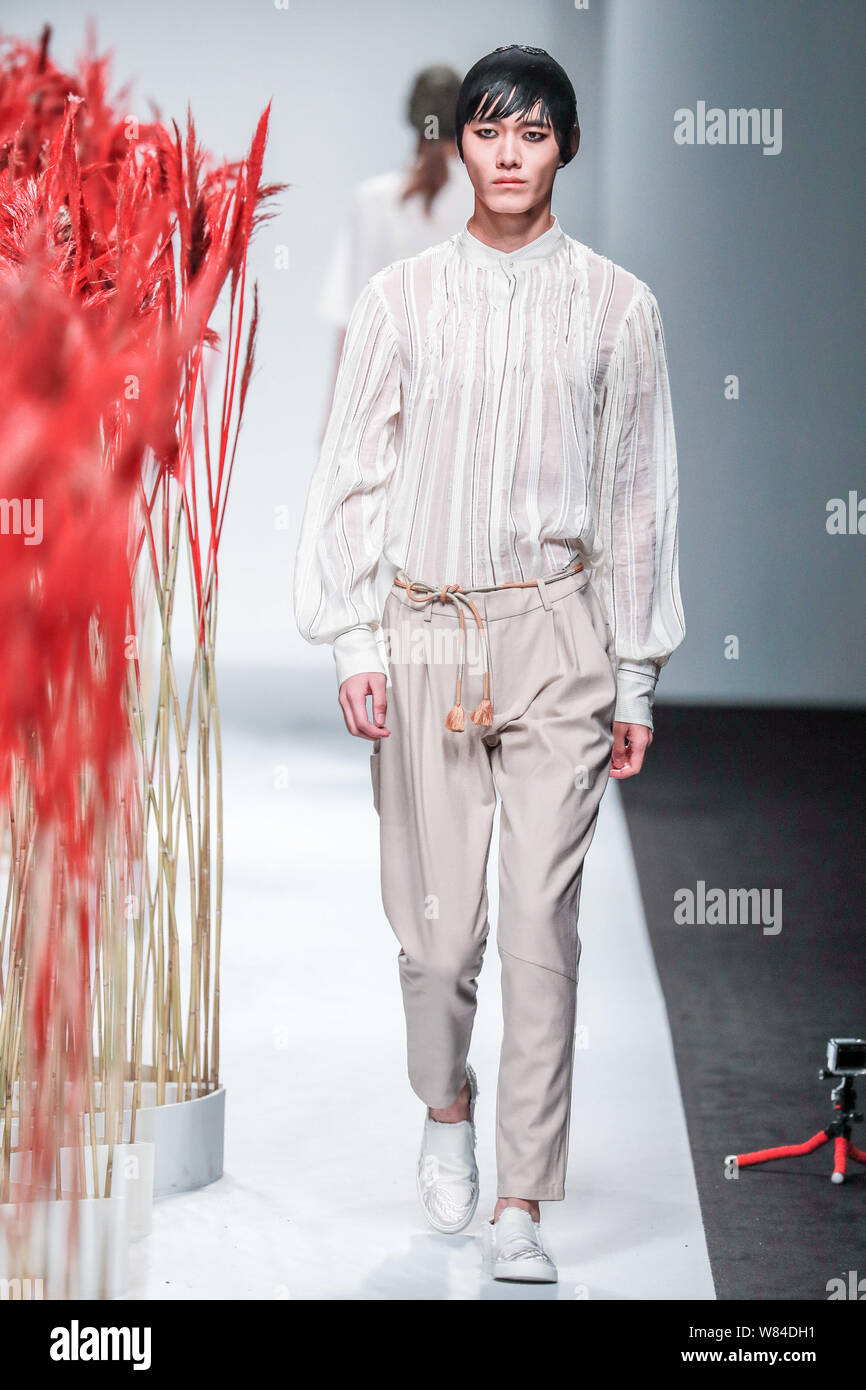 A model displays a new creation at the fashion show of Ji Cheng during ...