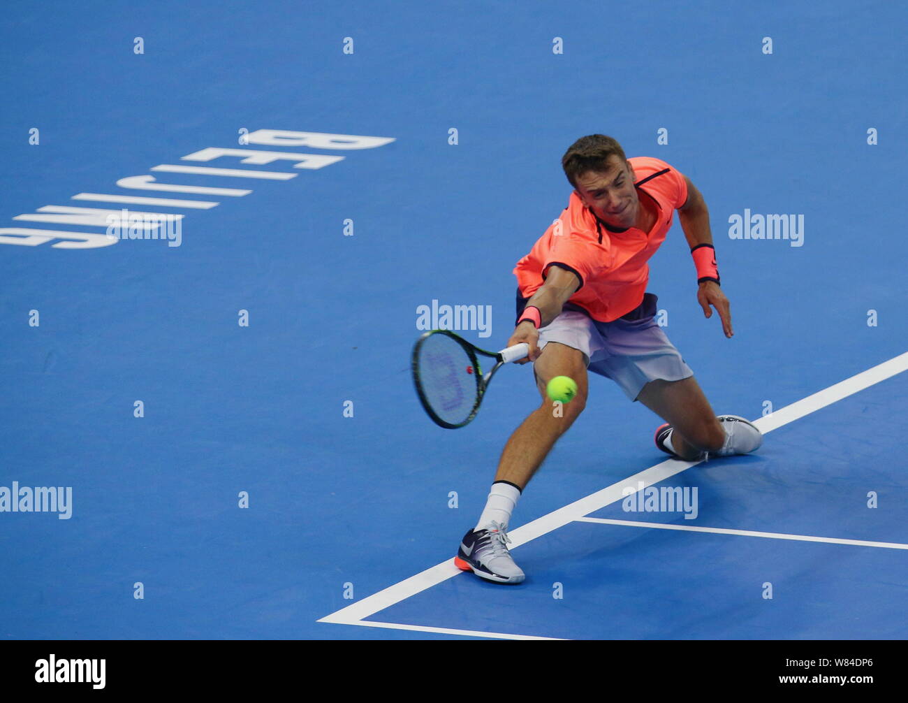 Andrei Kuznetsov of Russia returns a shot to Andy Murray of Britain in their men's singles ...