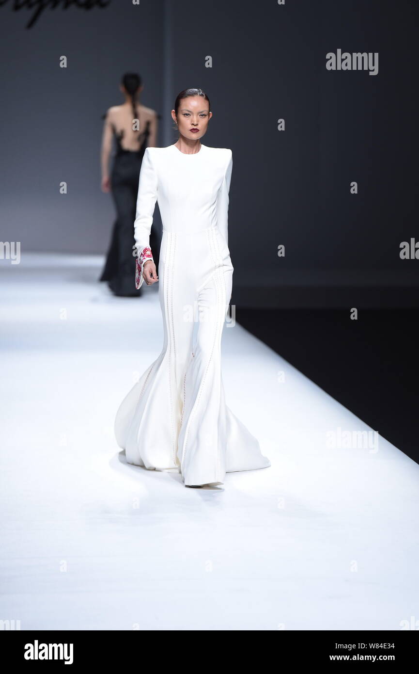 A model displays a new creation at the fashion show of Maryma fashion ...