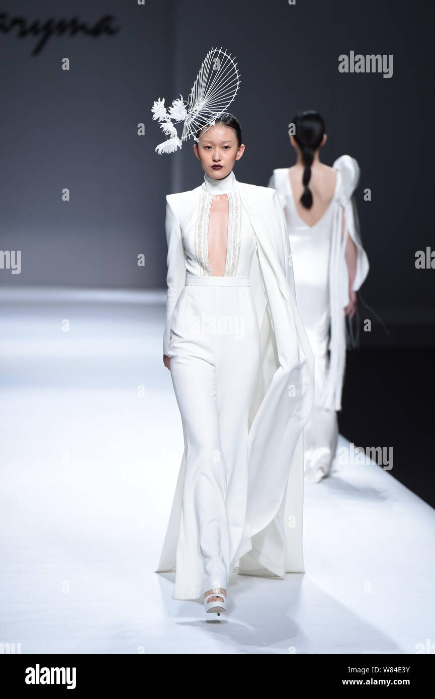 A model displays a new creation at the fashion show of Maryma fashion ...