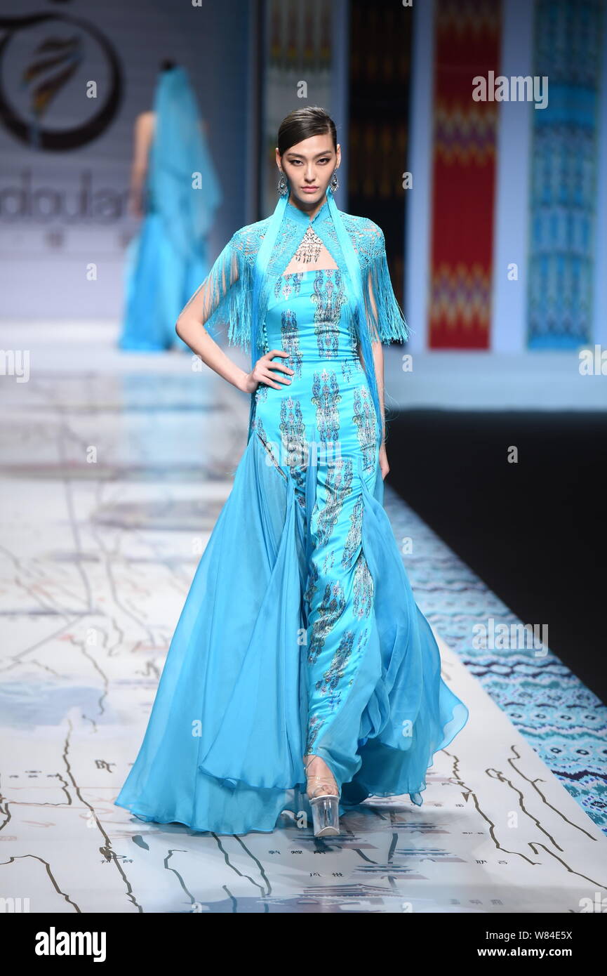 A model displays a new creation at a fashion show of TaoLouLan by Tao ...