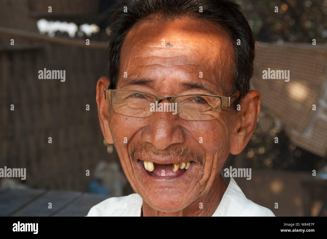 Portrait of Burmese man with missing teeth Stock Photo - Alamy