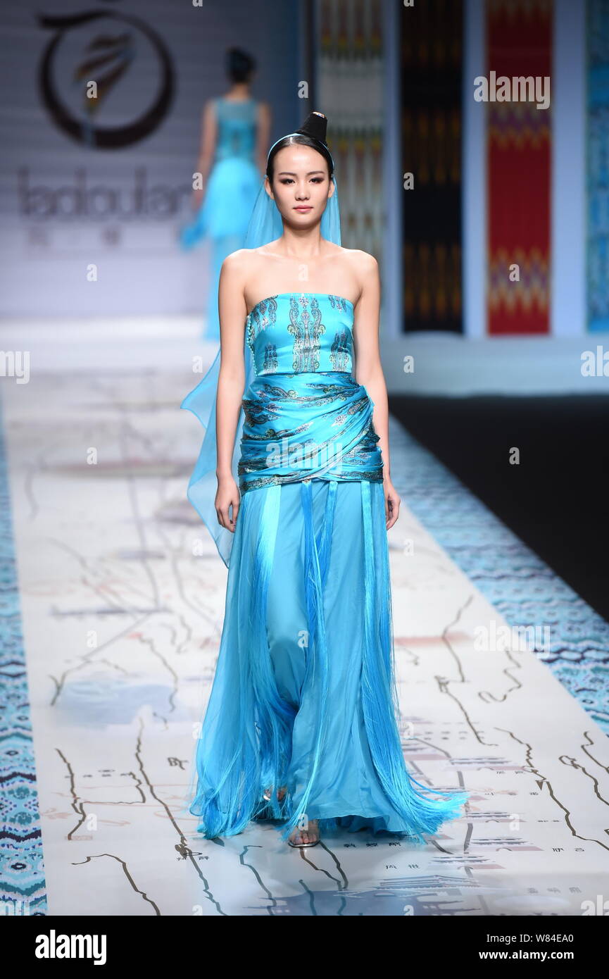 A model displays a new creation at a fashion show of TaoLouLan by Tao ...
