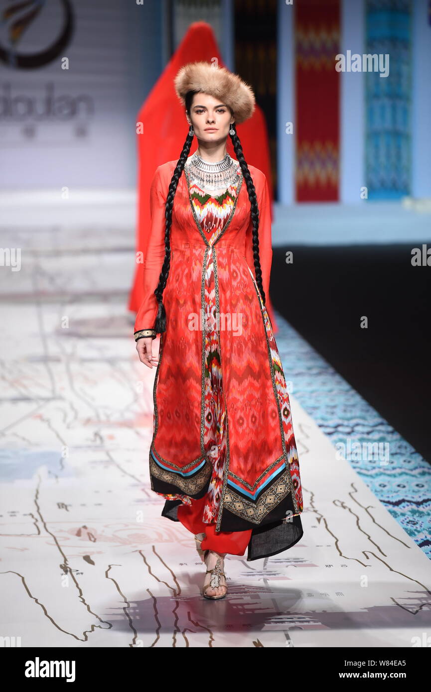 A model displays a new creation at a fashion show of TaoLouLan by Tao ...