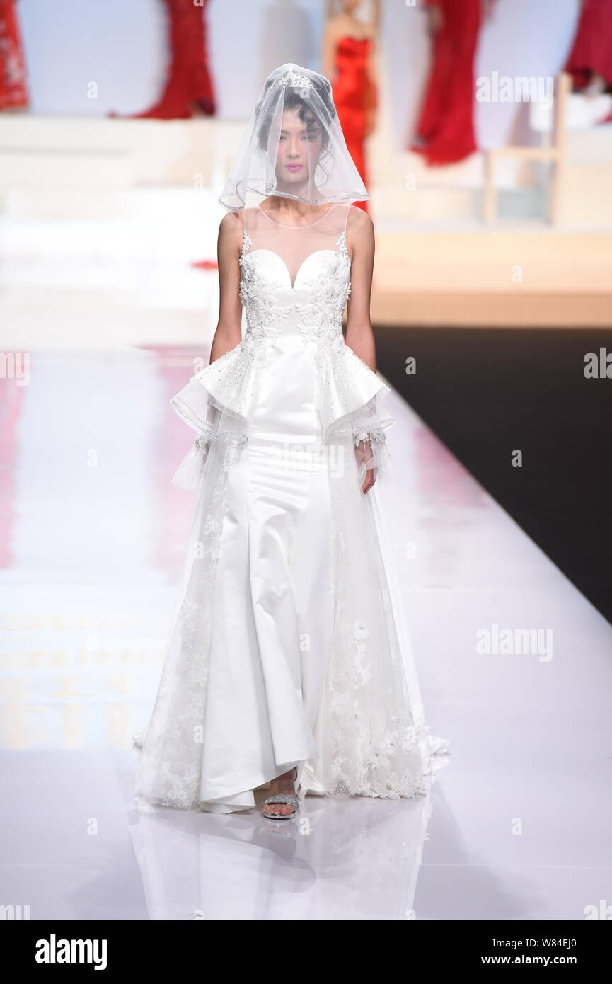 A model displays a new creation at the fashion show of Tsai Meiyue by ...