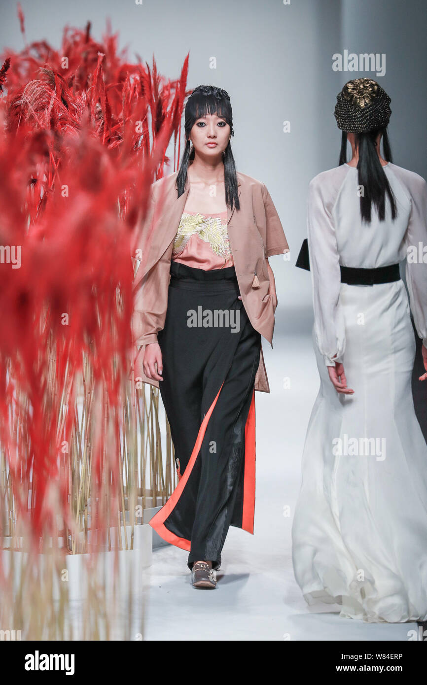 A model displays a new creation at the fashion show of Ji Cheng during ...