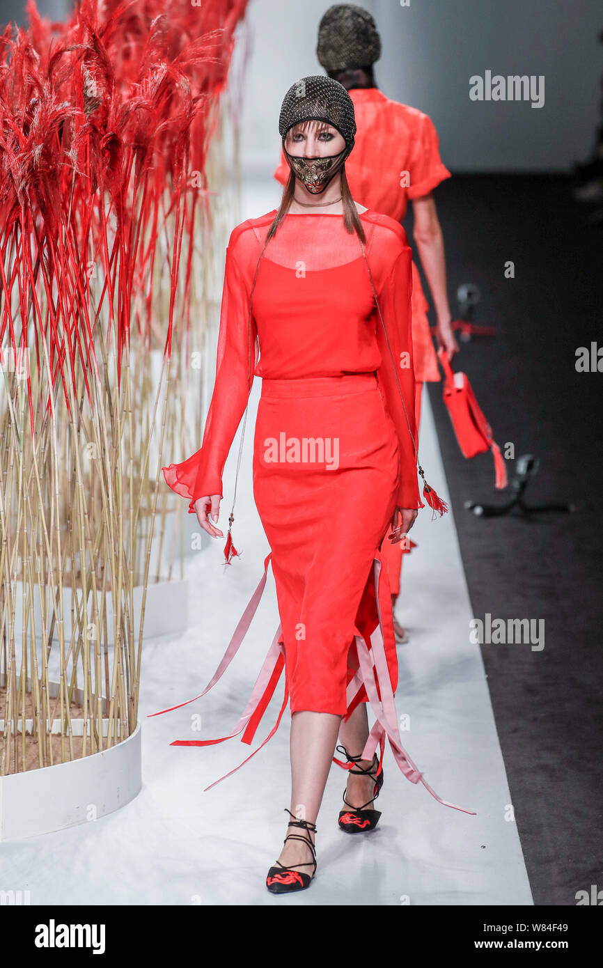 A model displays a new creation at the fashion show of Ji Cheng during ...