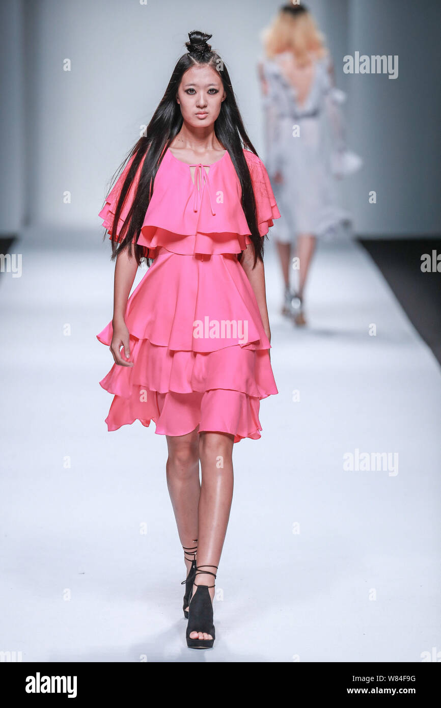 A model displays a new creation at the fashion show of Glamorous during ...