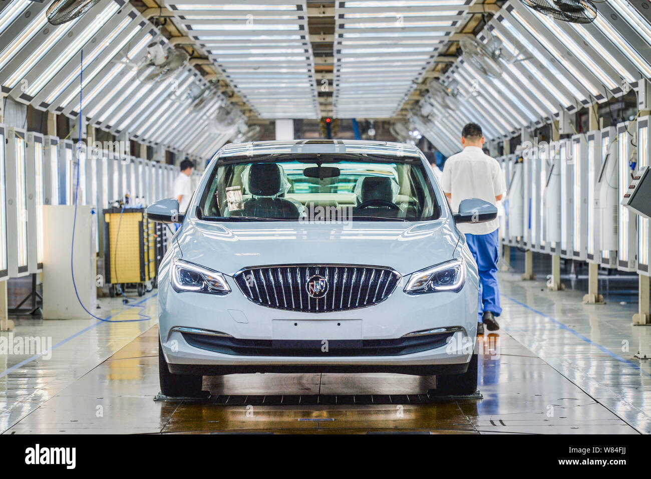New Buick cars pass through the assembly line at an auto plant of SAIC ...
