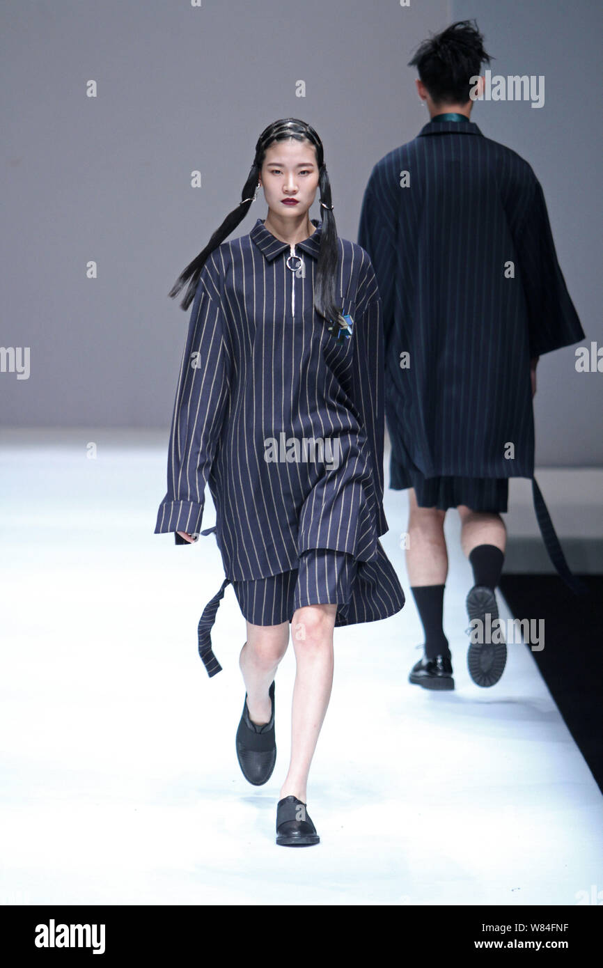 A model displays a new creation at a fashion show of LENGTHEN by Yang Liu & Yihang Liu during ...