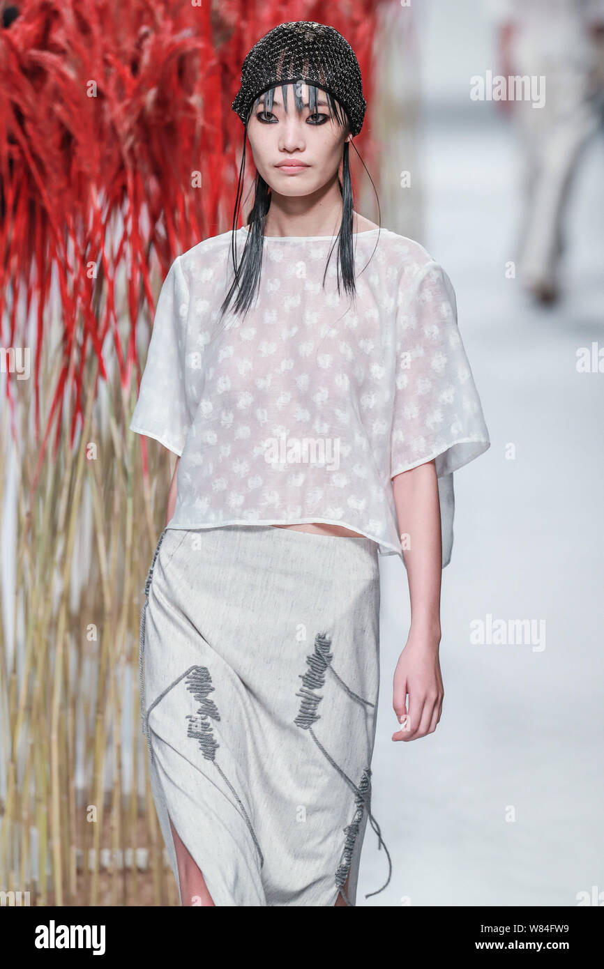 A model displays a new creation at the fashion show of Ji Cheng during ...