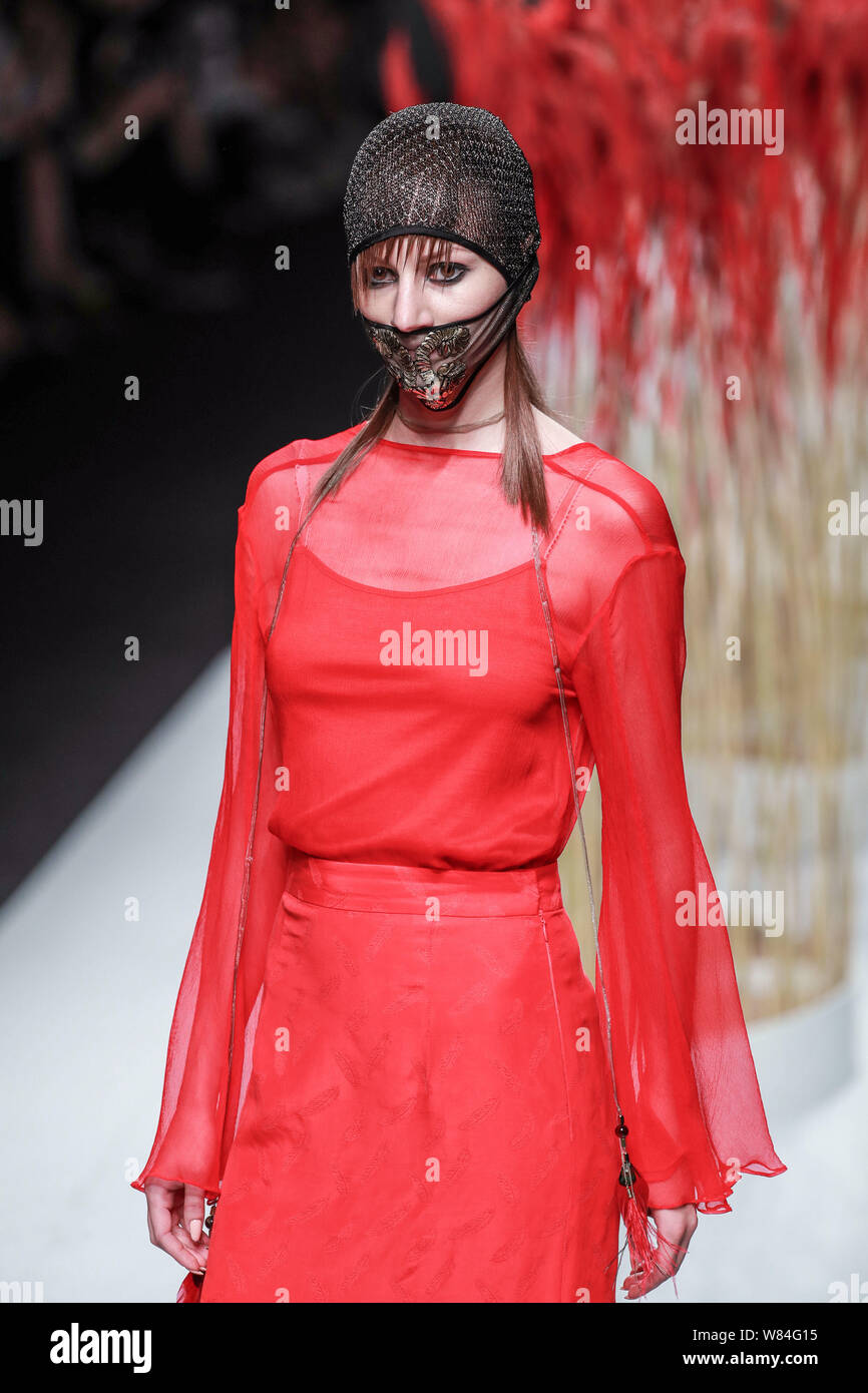A model displays a new creation at the fashion show of Ji Cheng during ...