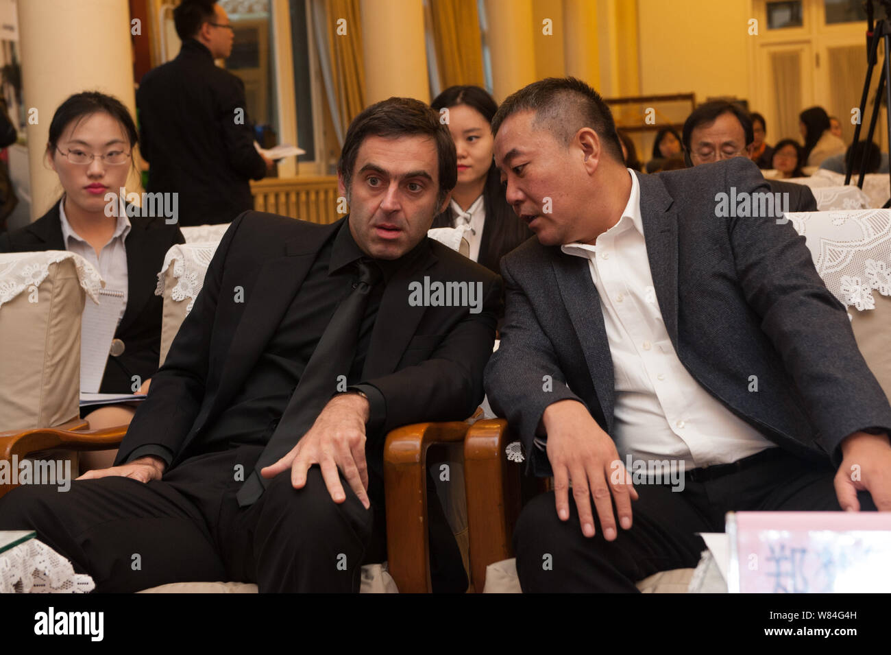 English snooker player Ronnie O'Sullivan, left, attends a charity event ...