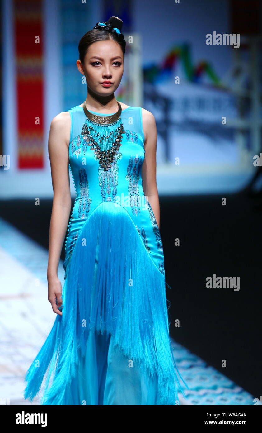 A model displays a new creation at a fashion show of TaoLouLan by Tao ...