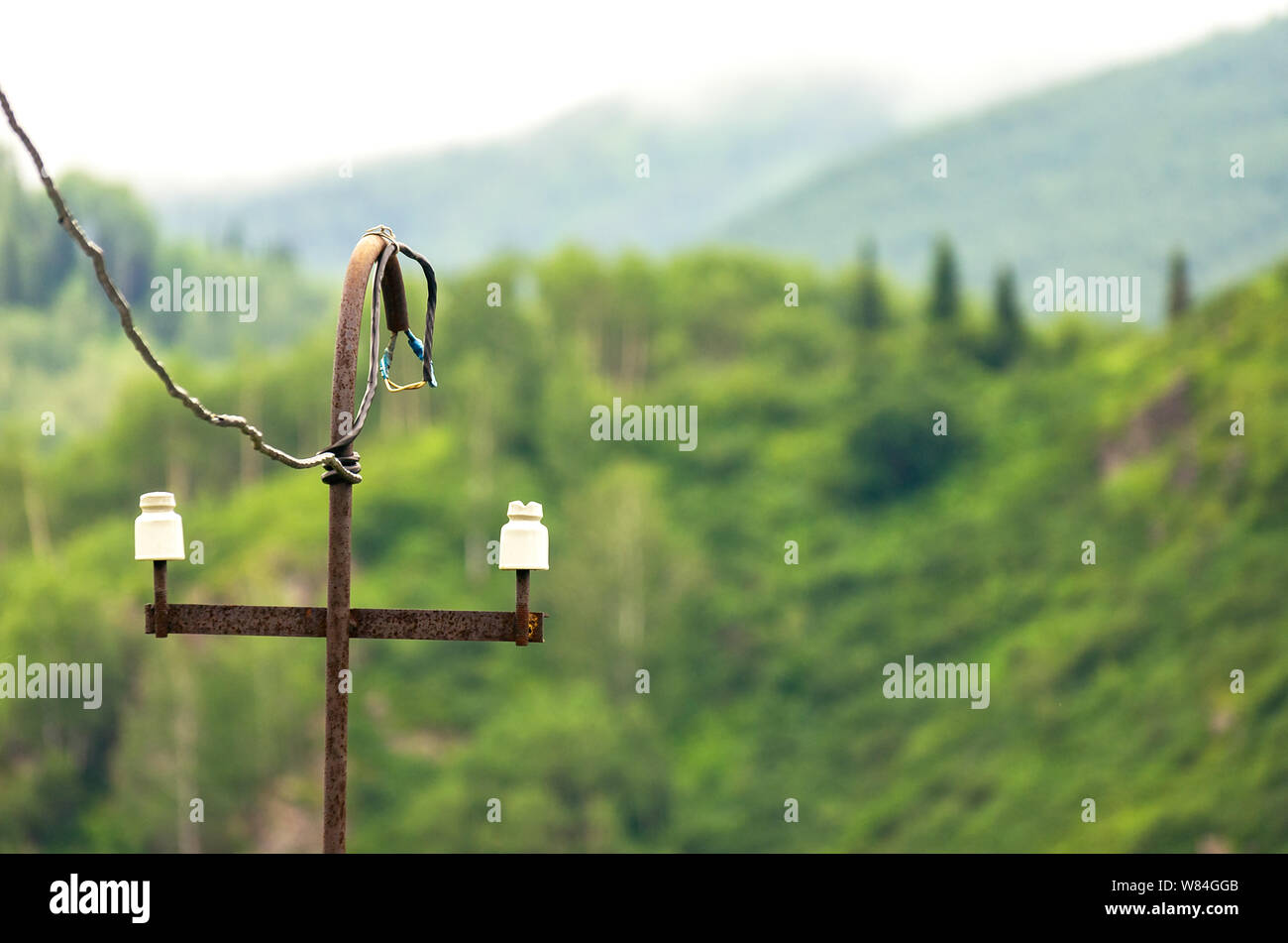 Old Rusty Electric Power Riser Pole, Wires with Electrical Tape ...