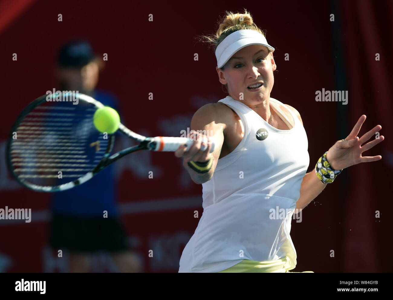 Bethanie Mattek-Sands of the United States returns a shot to Caroline ...