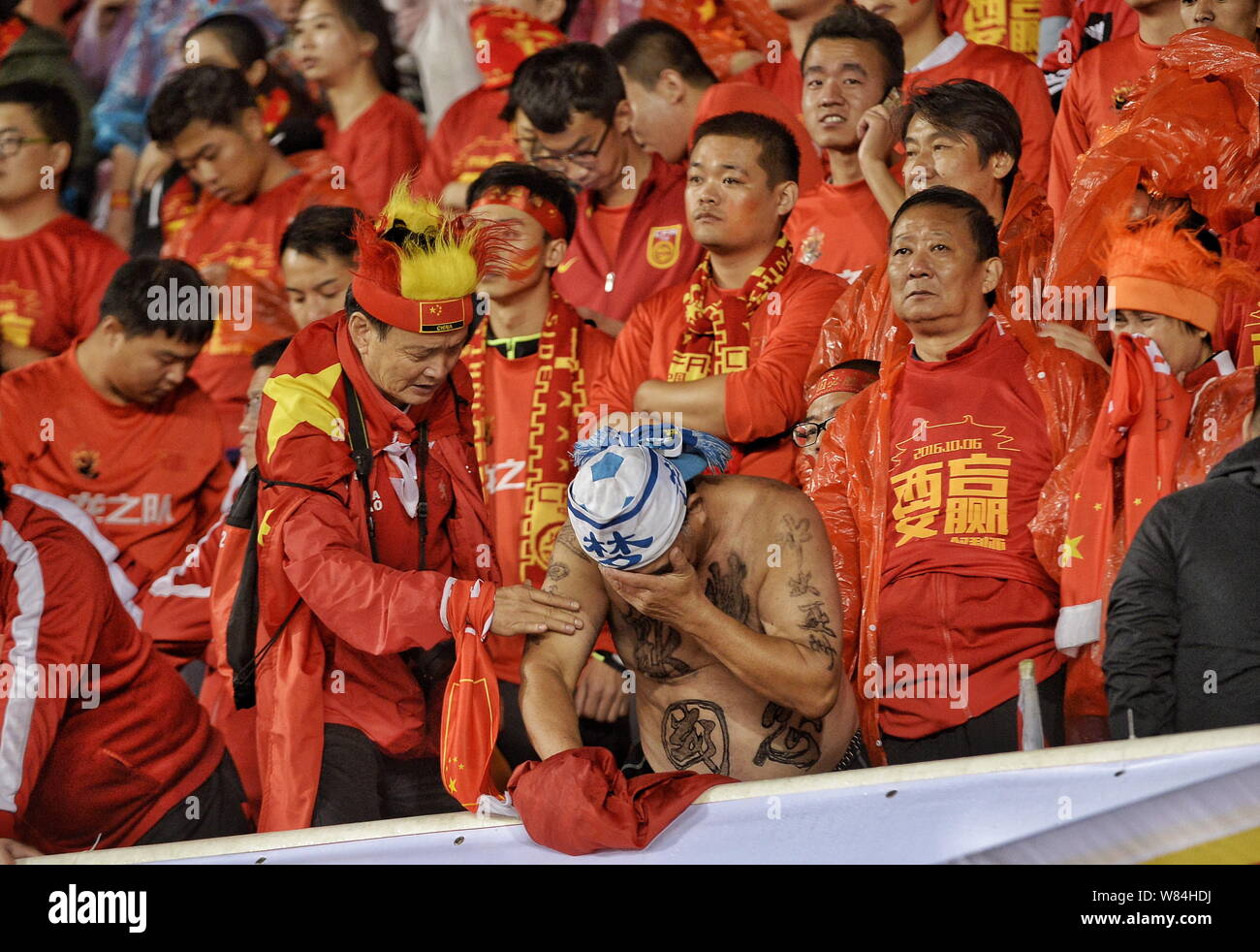 Chinese football fans react after the Chinese national soccer team ...