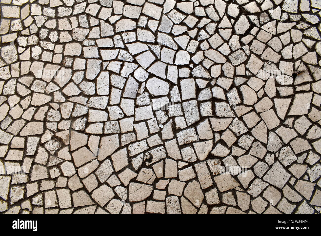 Irregular white stones rough mosaic pattern. Broken tiles, floor ...