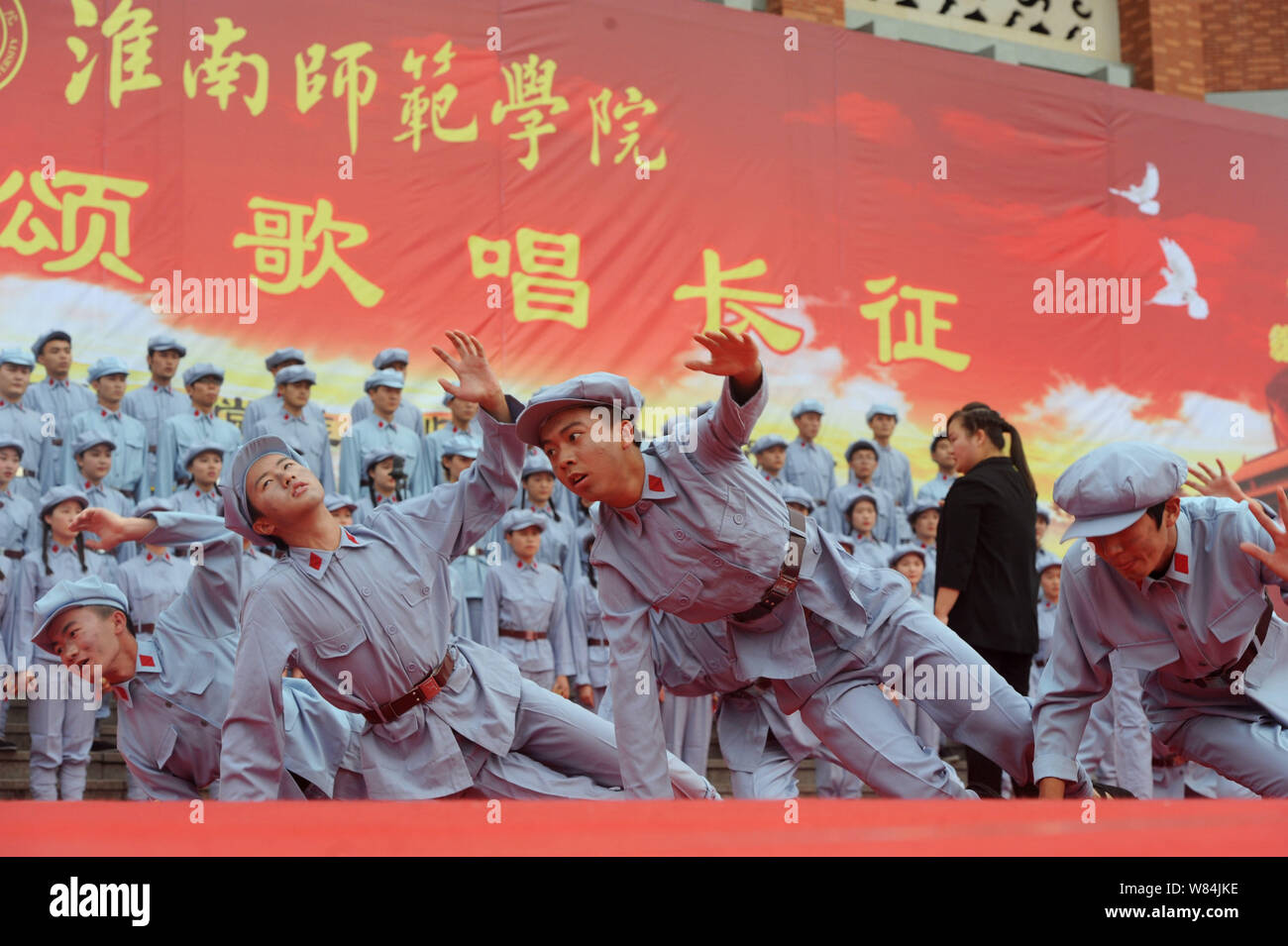 Young Chinese students dressed in Red Army costumes perform during a ...