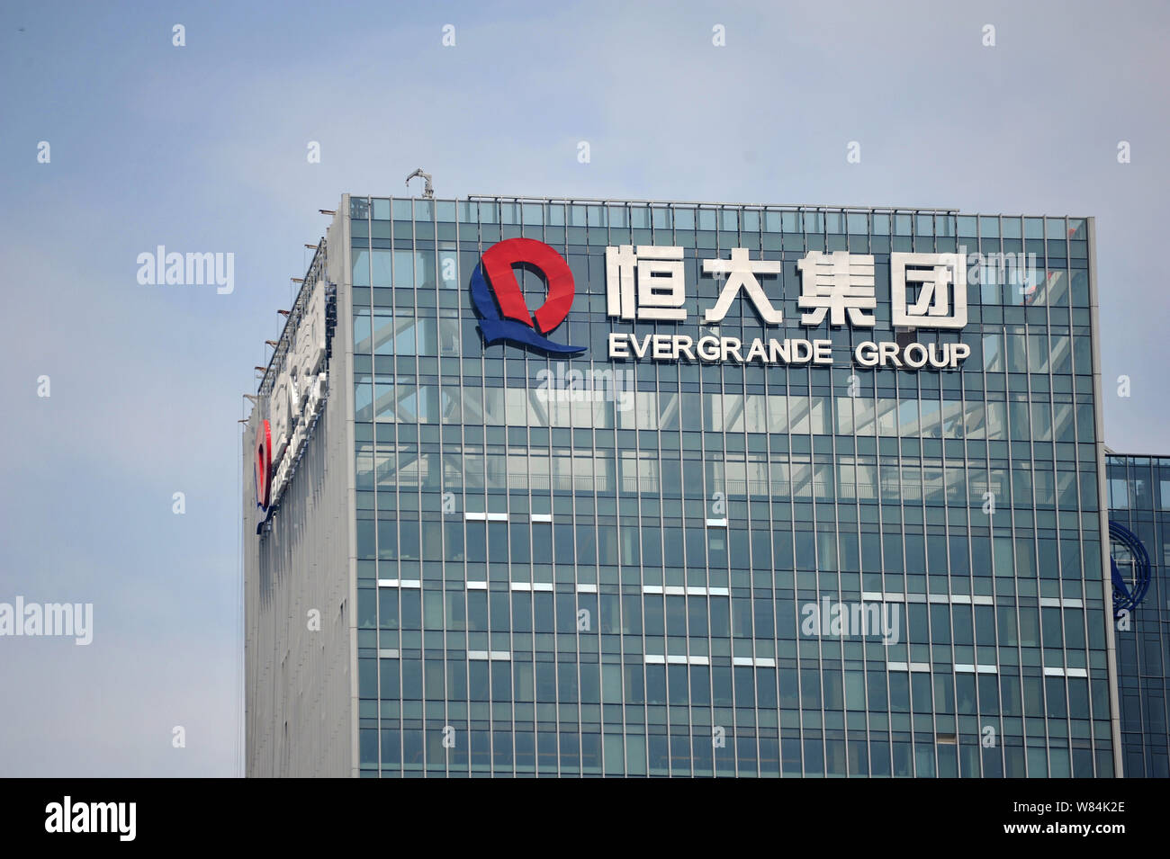 --FILE--View of a logo of Evergrande Group on a high-rise office ...