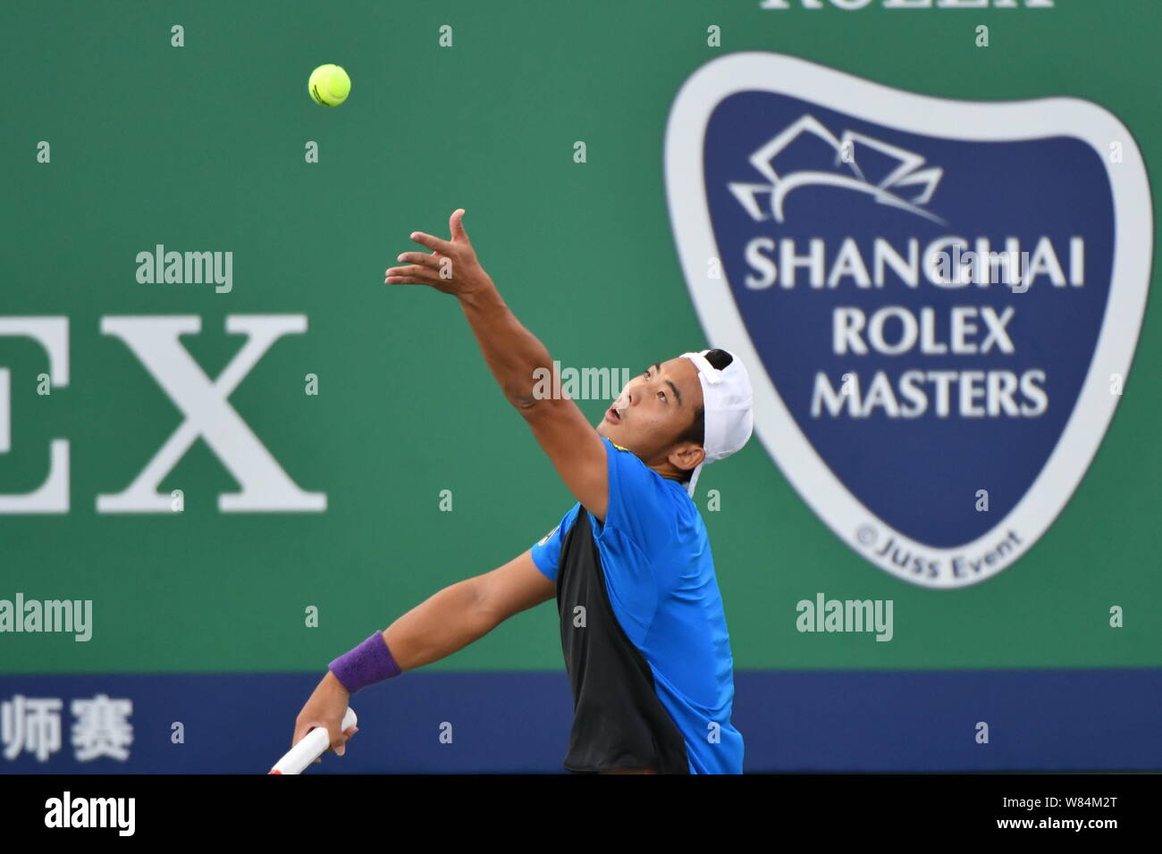 Zhang Ze of China serves against Mischa Zverev of Germany in their ...