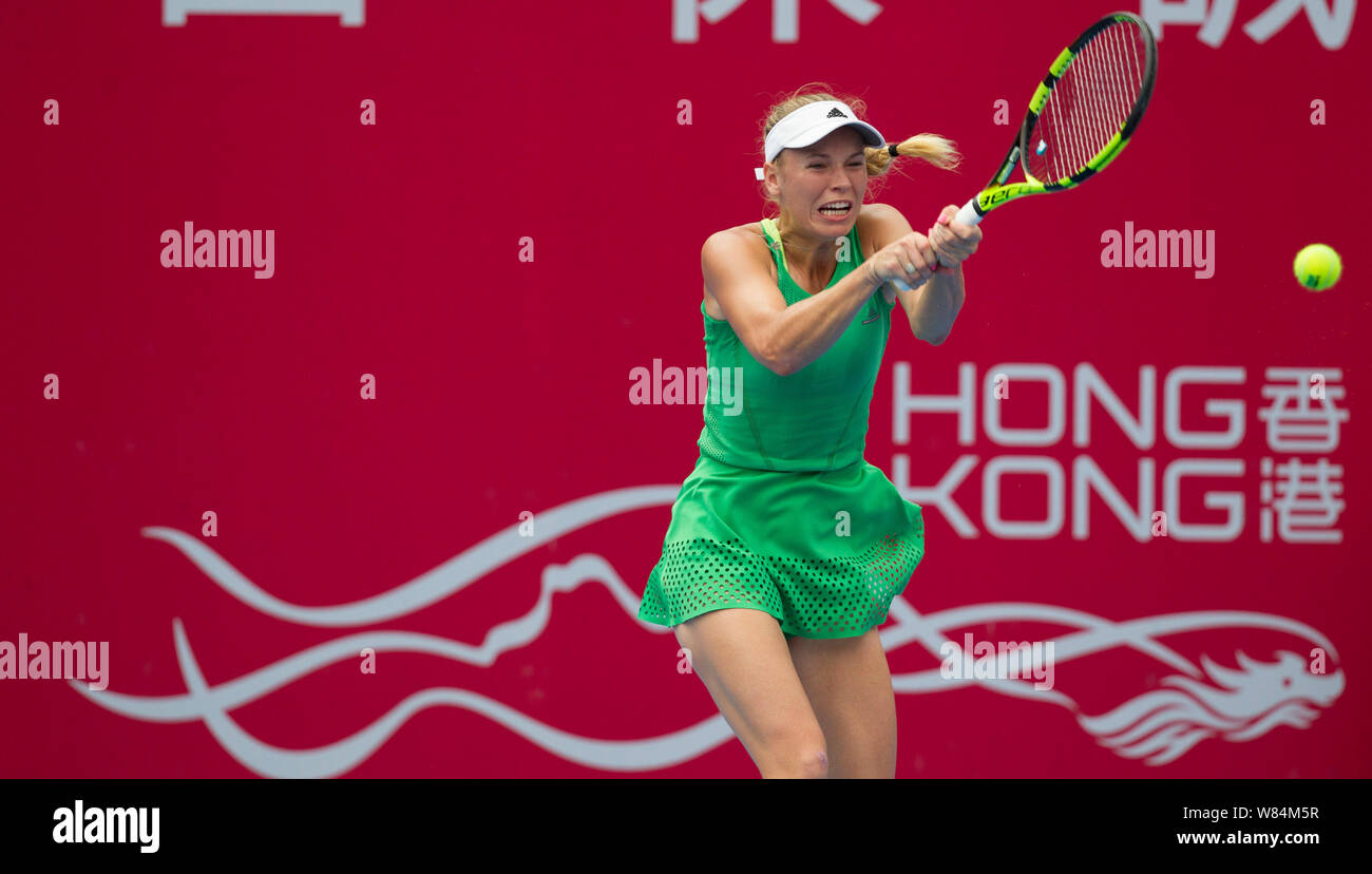 Caroline Wozniacki of Denmark returns a shot to Zheng Saisai of China ...