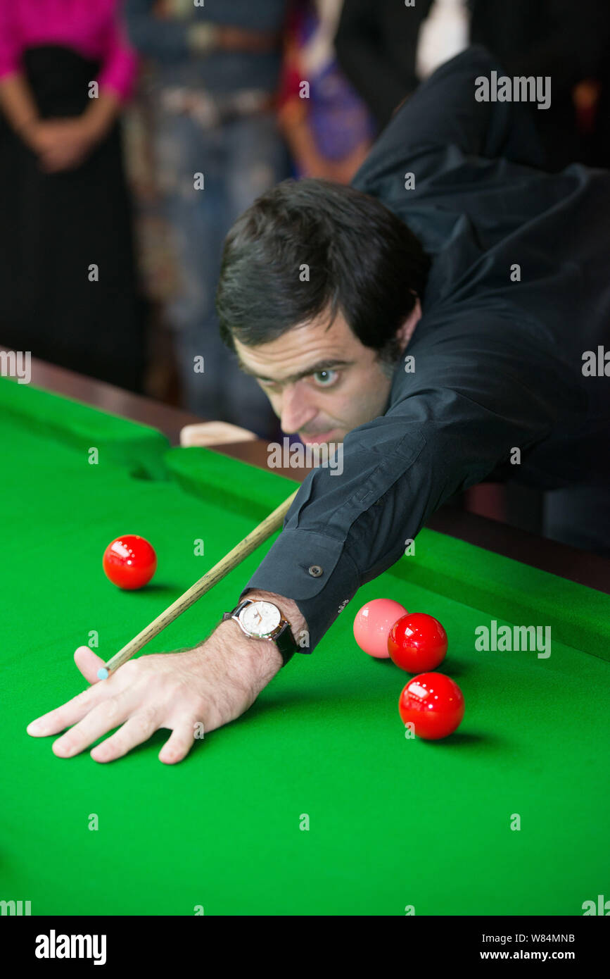 English snooker player Ronnie O'Sullivan shows his snooker skills at a ...