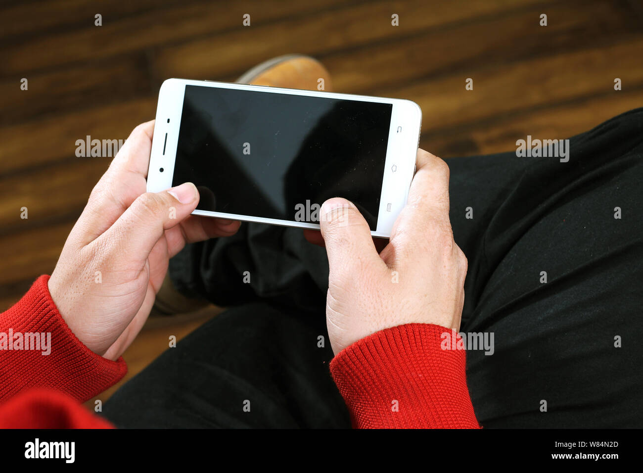 Picture of man holding a mobile in hand. Isolated on white background ...