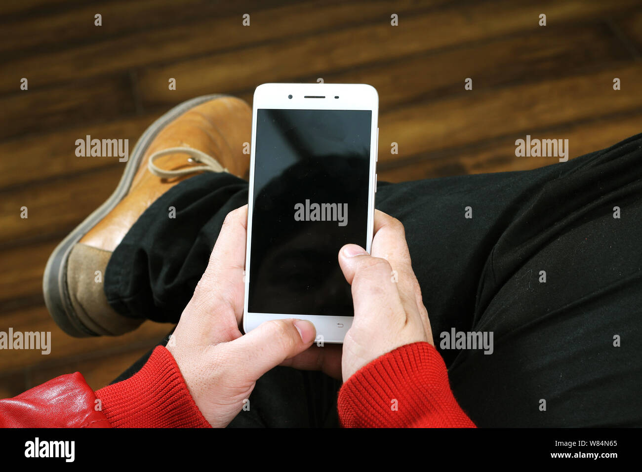 Picture of man holding a mobile in hand. Isolated on white background ...
