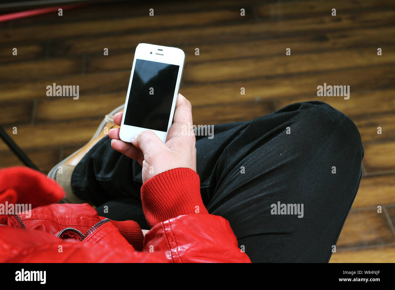 Picture of man holding a mobile in hand. Isolated on white background ...