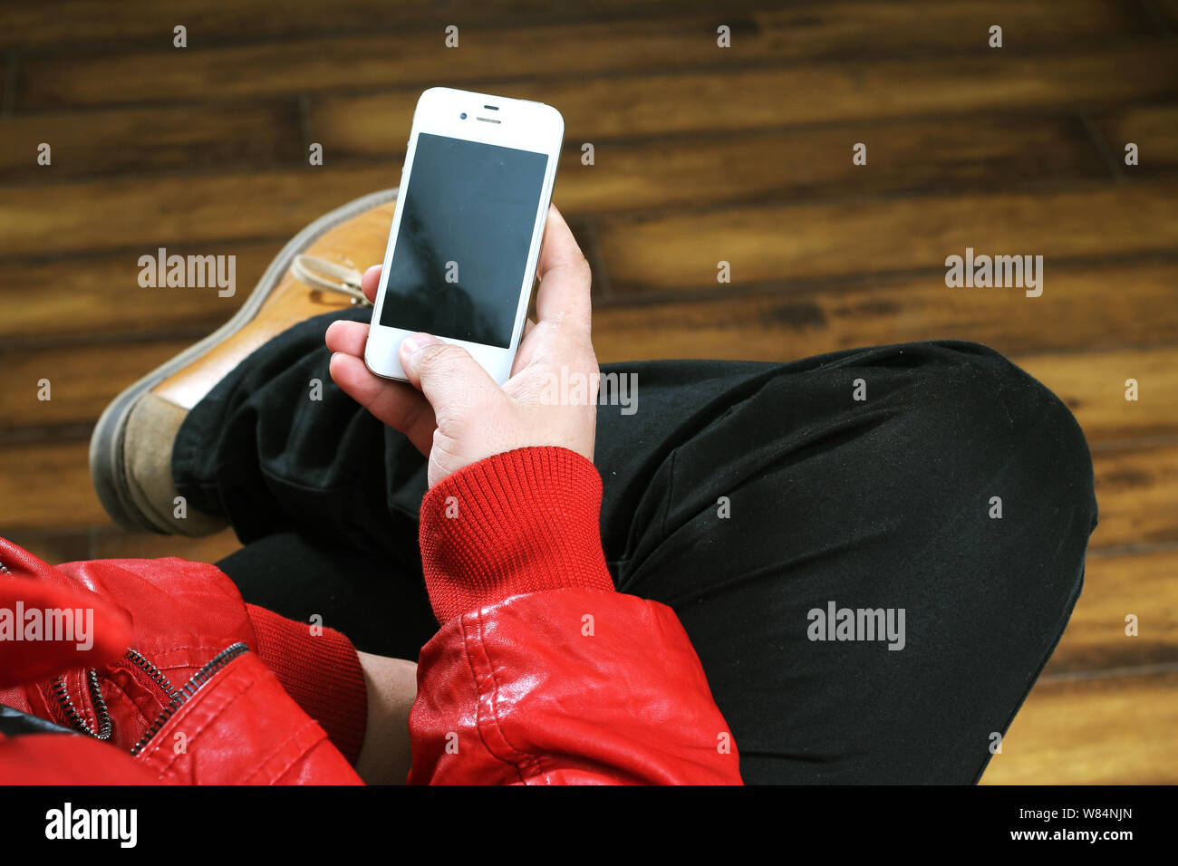 Picture of man holding a mobile in hand. Isolated on white background ...