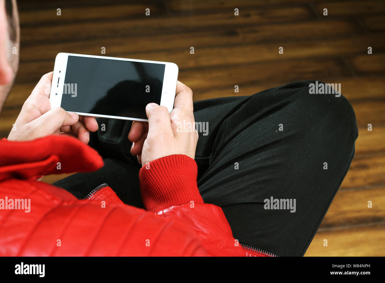 Picture of man holding a mobile in hand. Isolated on white background ...