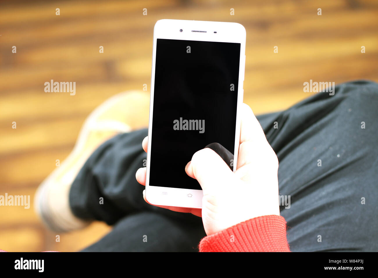 Picture of man holding a mobile in hand. Isolated on white background ...