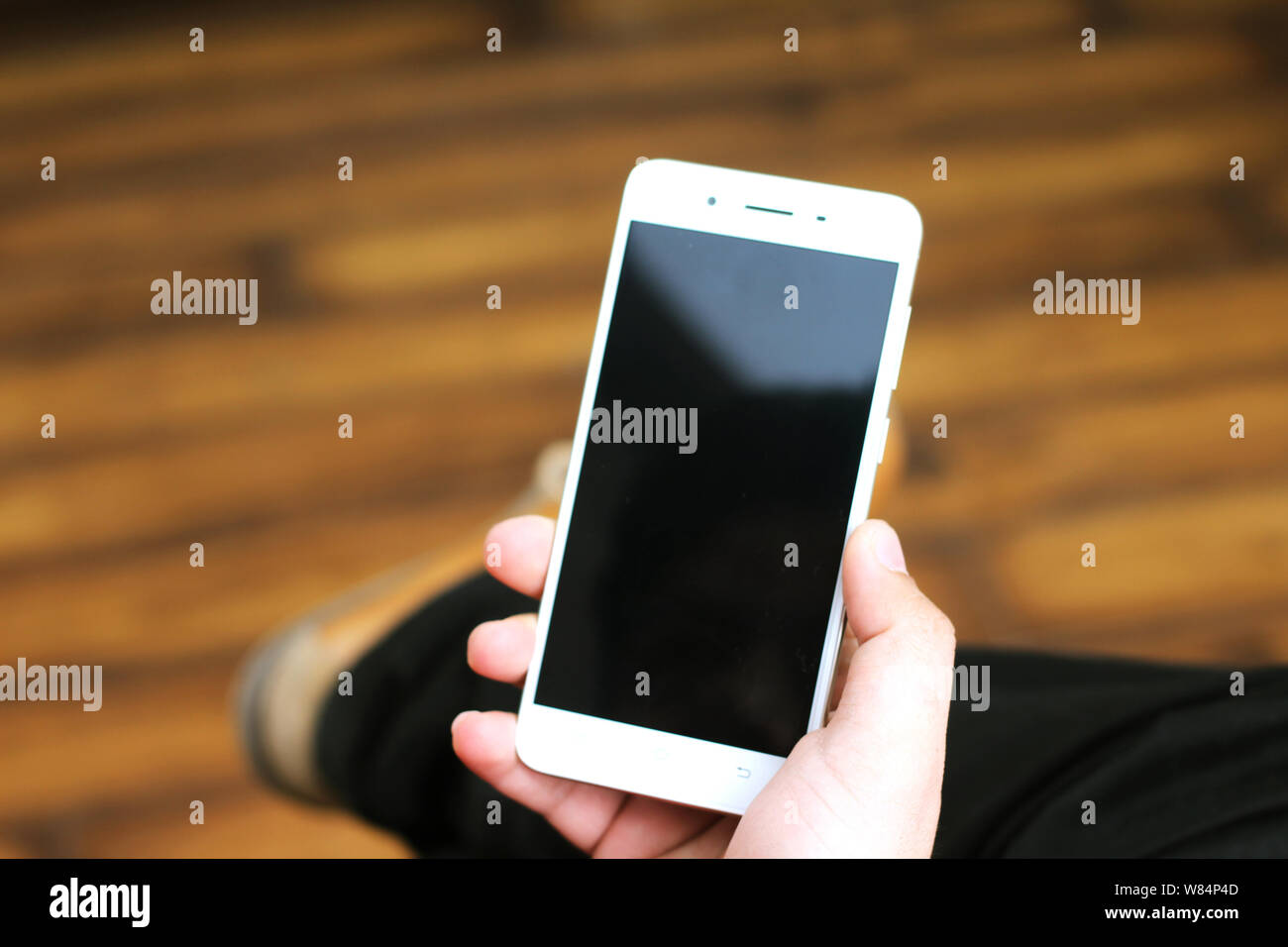 Picture of man holding a mobile in hand. Isolated on white background ...