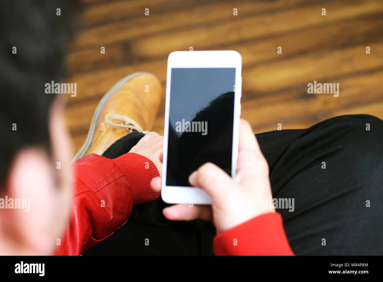 Picture of a man holding a mobile in hand. Isolated on white background ...