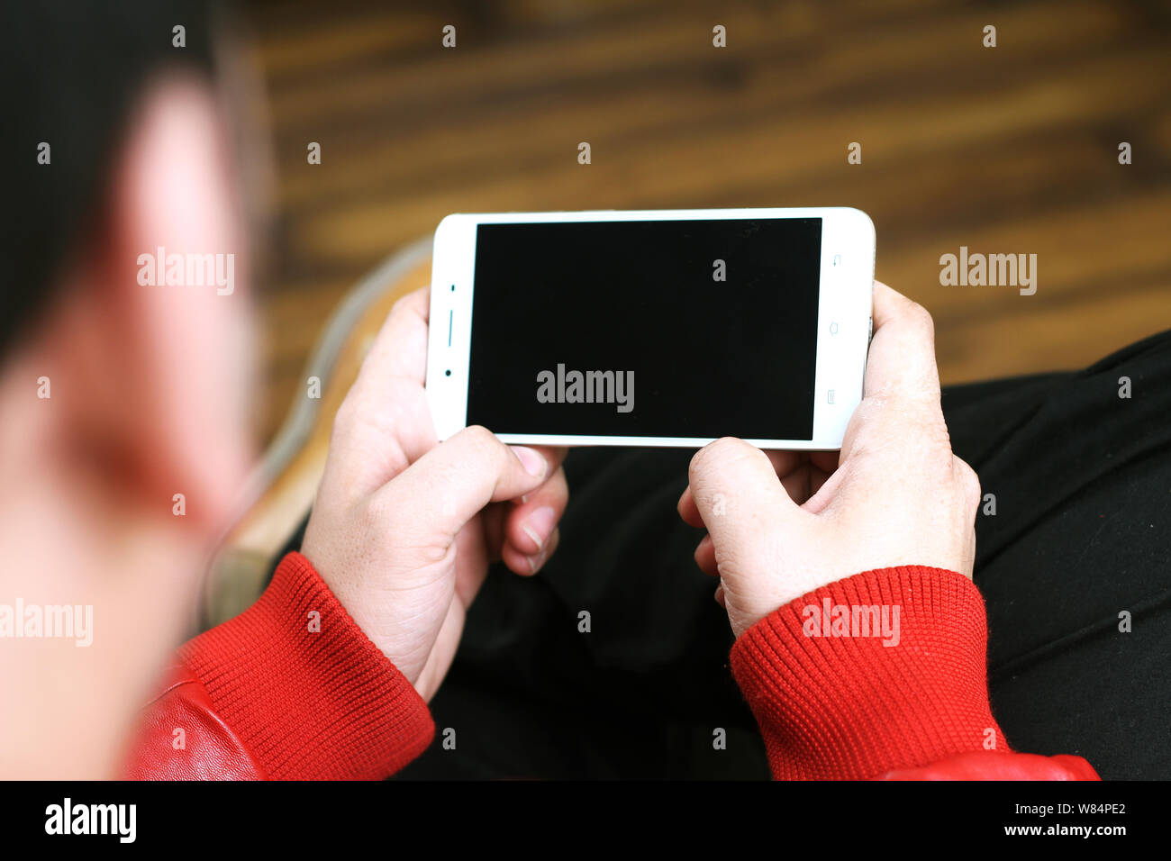 Picture of a man holding a mobile in hand. Isolated on white background ...