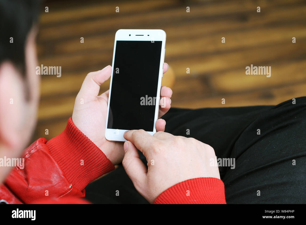 Picture of a man holding a mobile in hand. Isolated on white background ...
