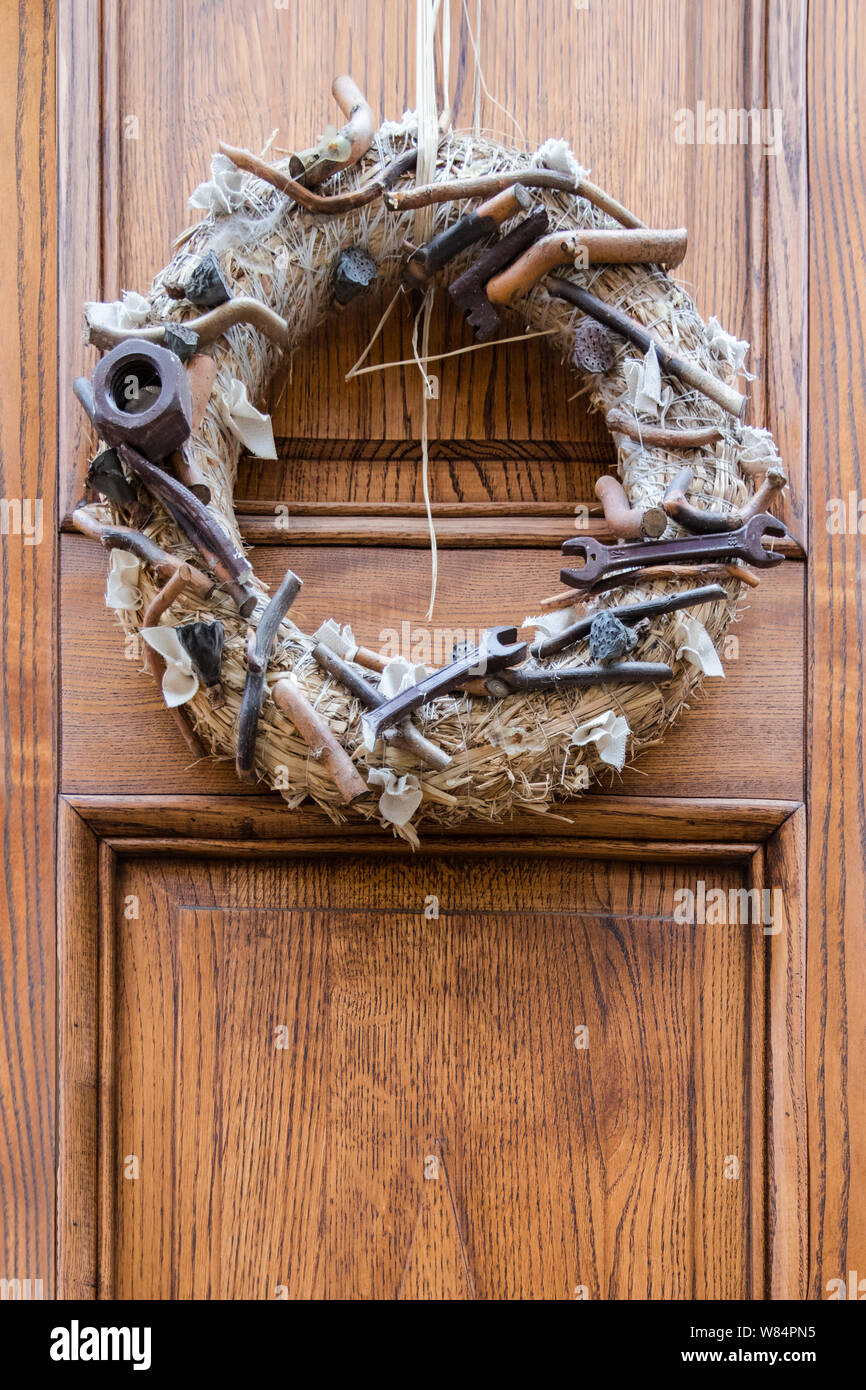 Exterior decoration on the door. Decorative wreath made of straw ...