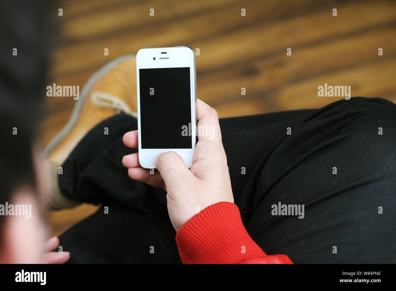 Picture of a man holding a mobile in hand. Isolated on white background ...