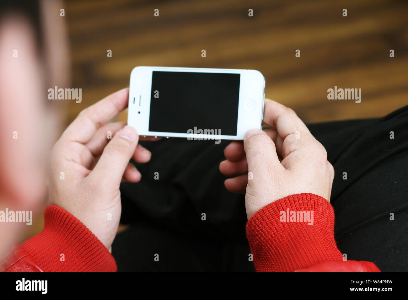 Picture of a man holding a mobile in hand. Isolated on white background ...