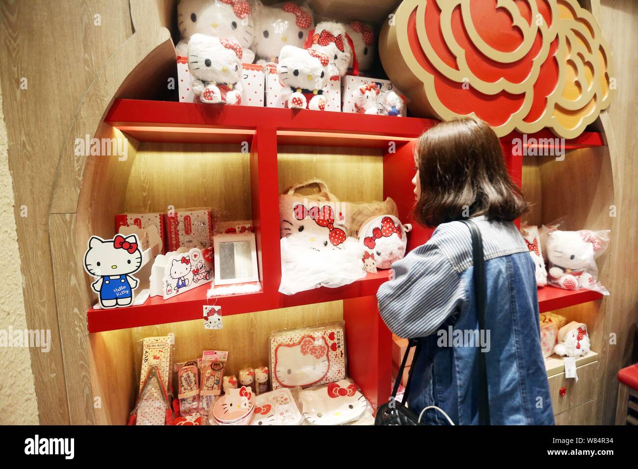 A girl looks at souvenirs at the Hello Kitty hot-pot restaurant in ...