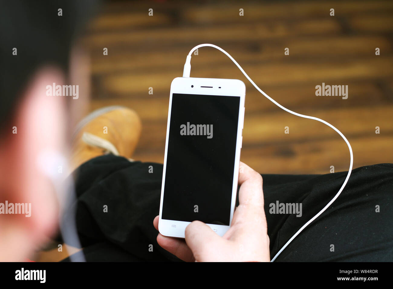 Picture of man holding a mobile in hand. Isolated on white background ...